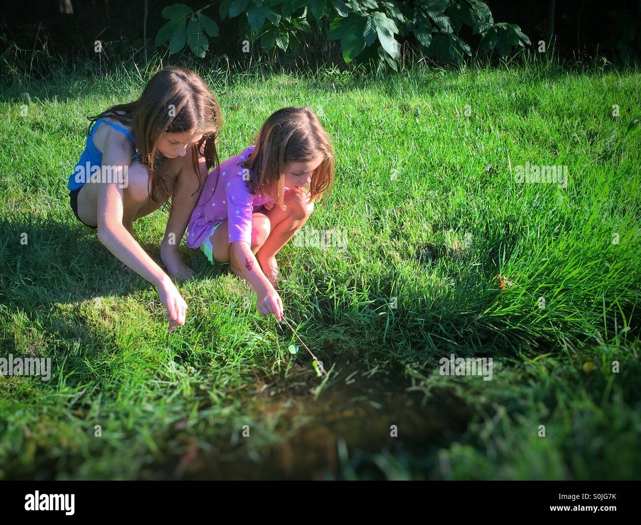 Two girls by the pond hi-res stock photography and images - Alamy