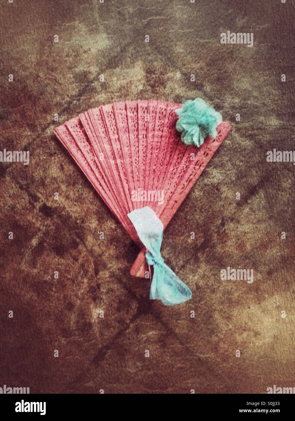 Red fan on the floor Stock Photo - Alamy