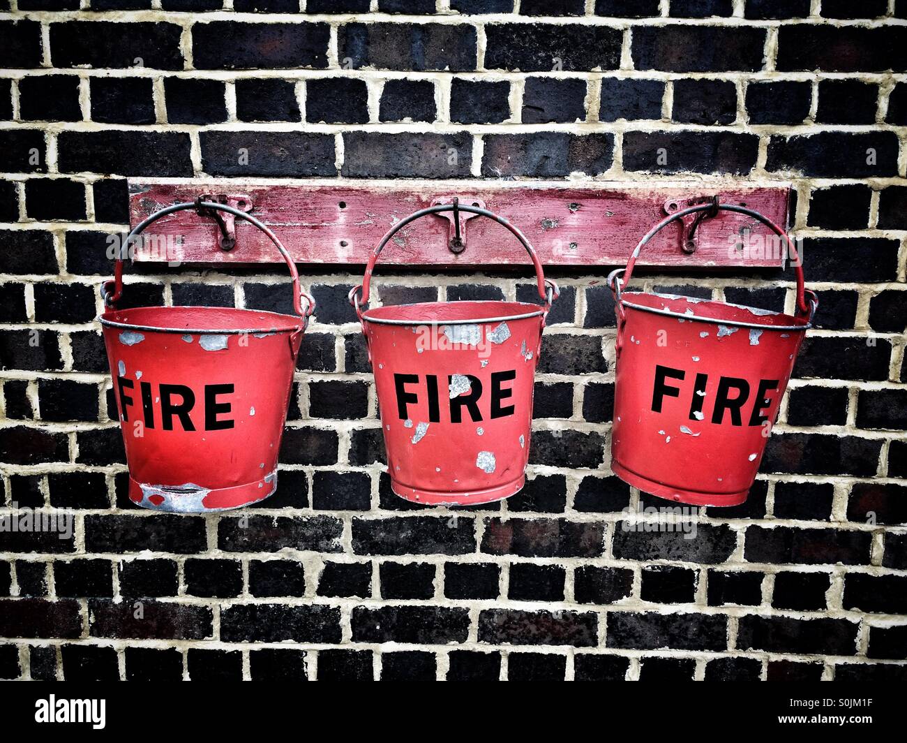 Red water buckets hi-res stock photography and images - Alamy