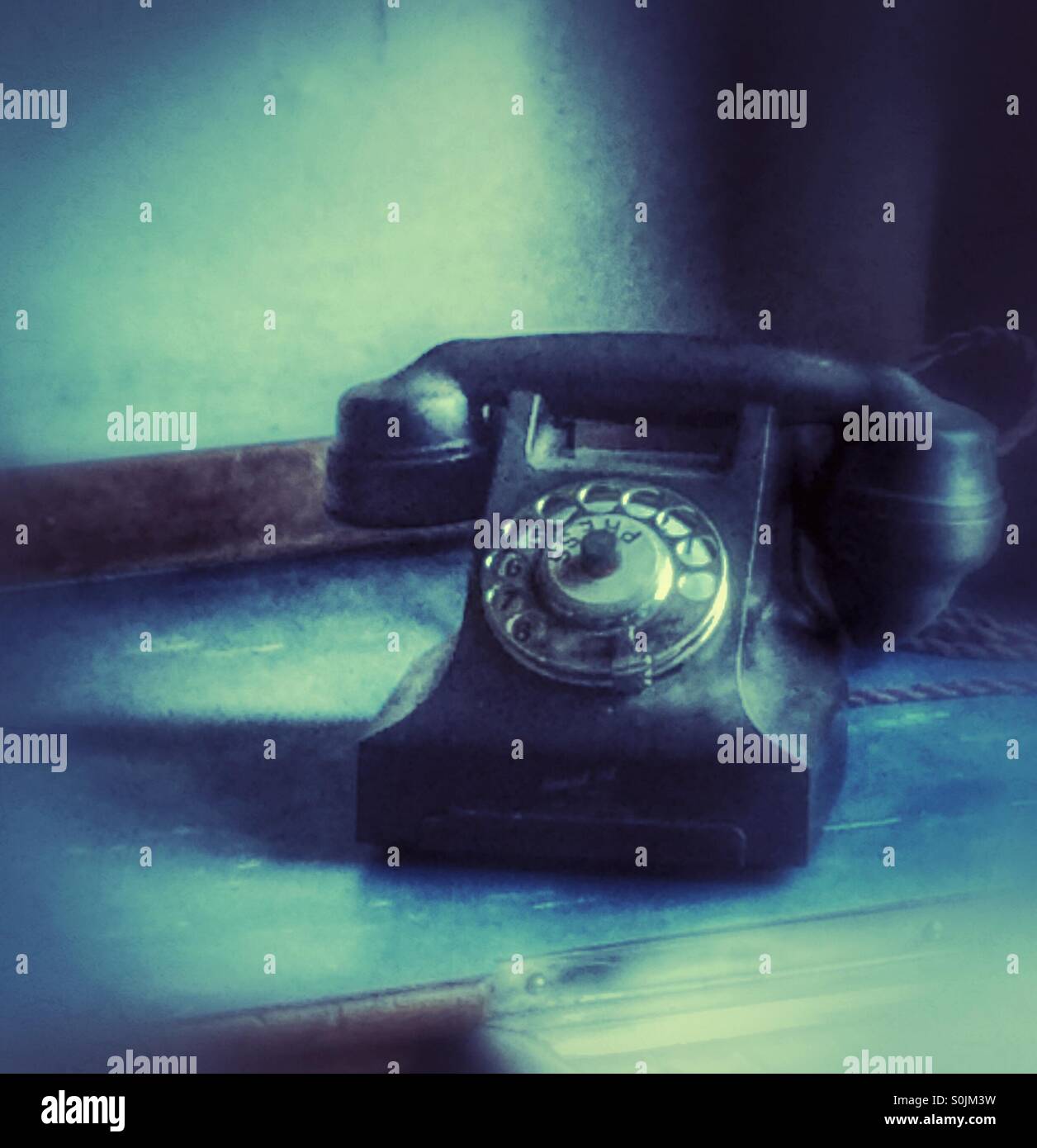 Old fashioned telephone with dial Stock Photo - Alamy
