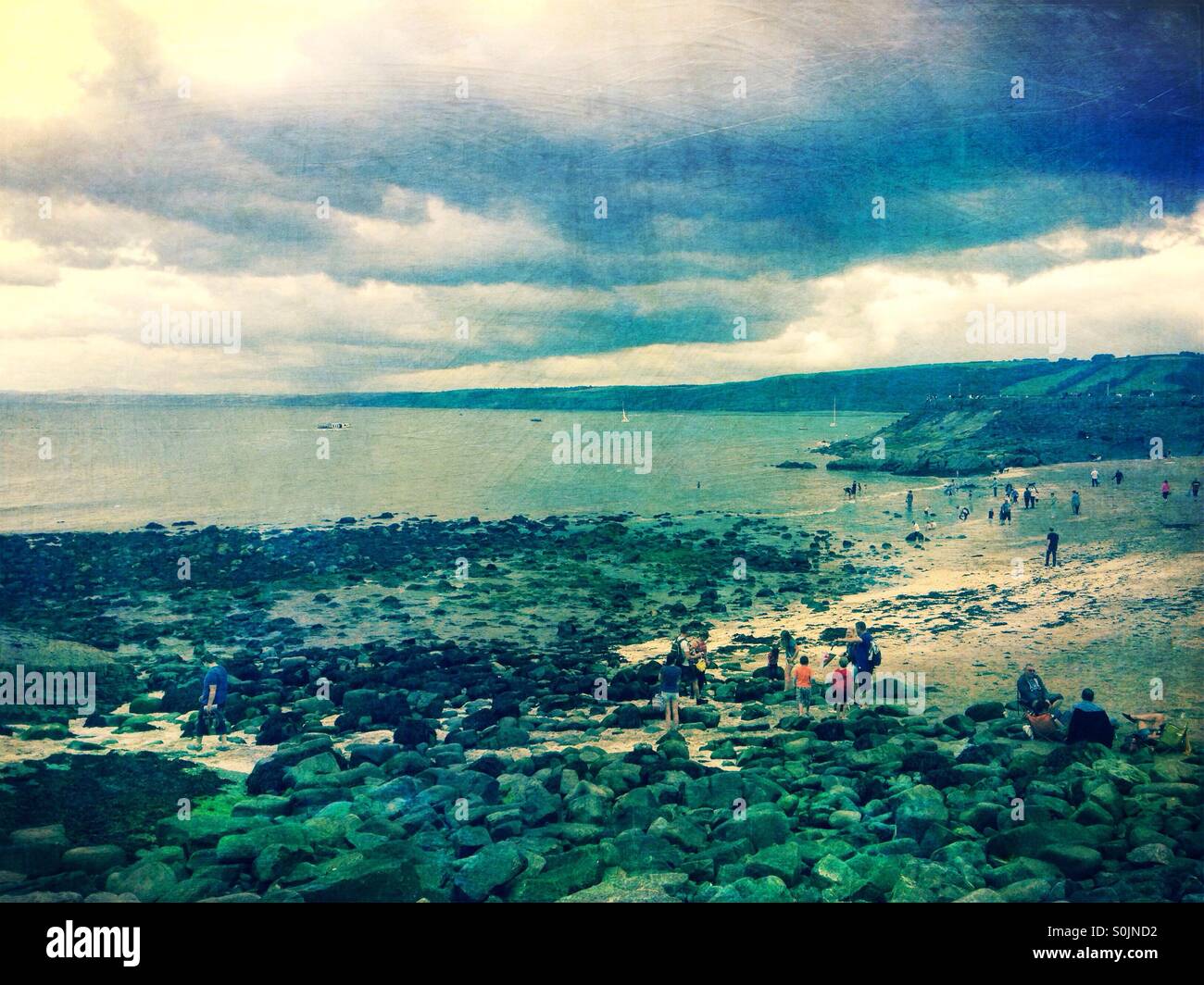 A sandy and rocky beach at New Quay Stock Photo - Alamy