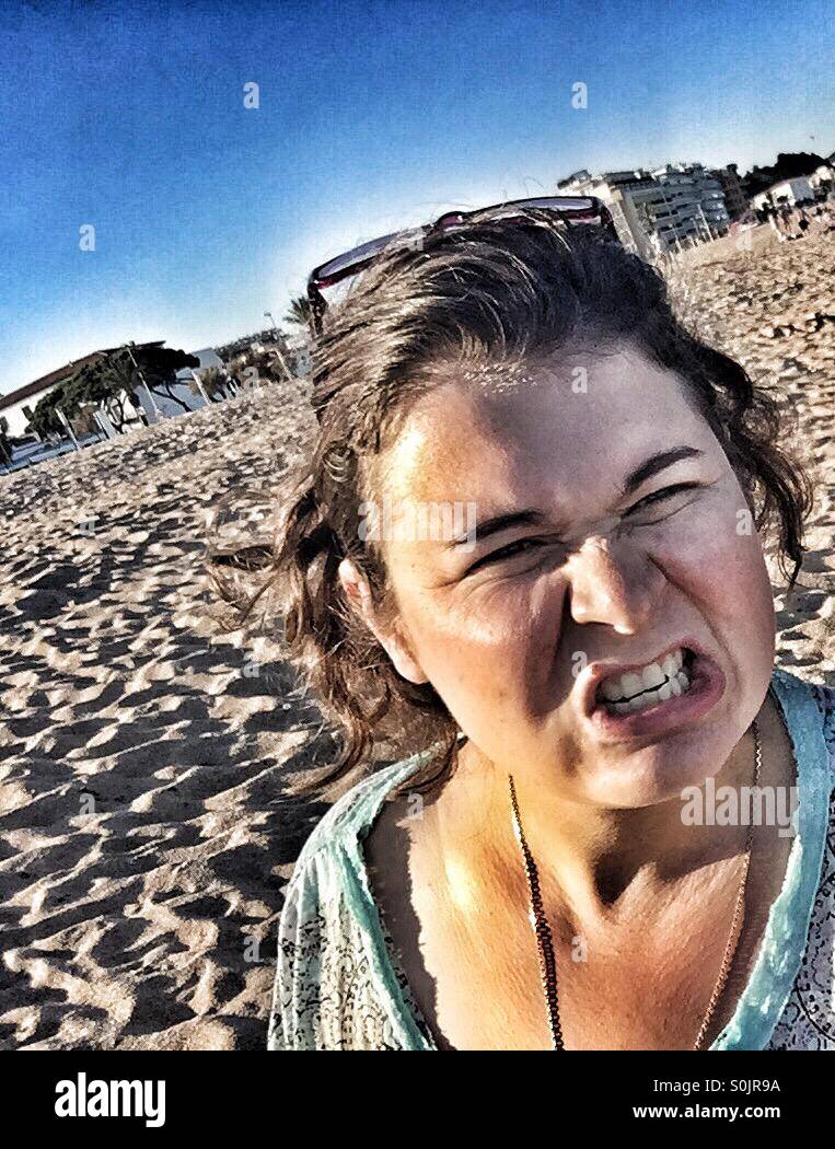 Angry woman on the beach Stock Photo - Alamy