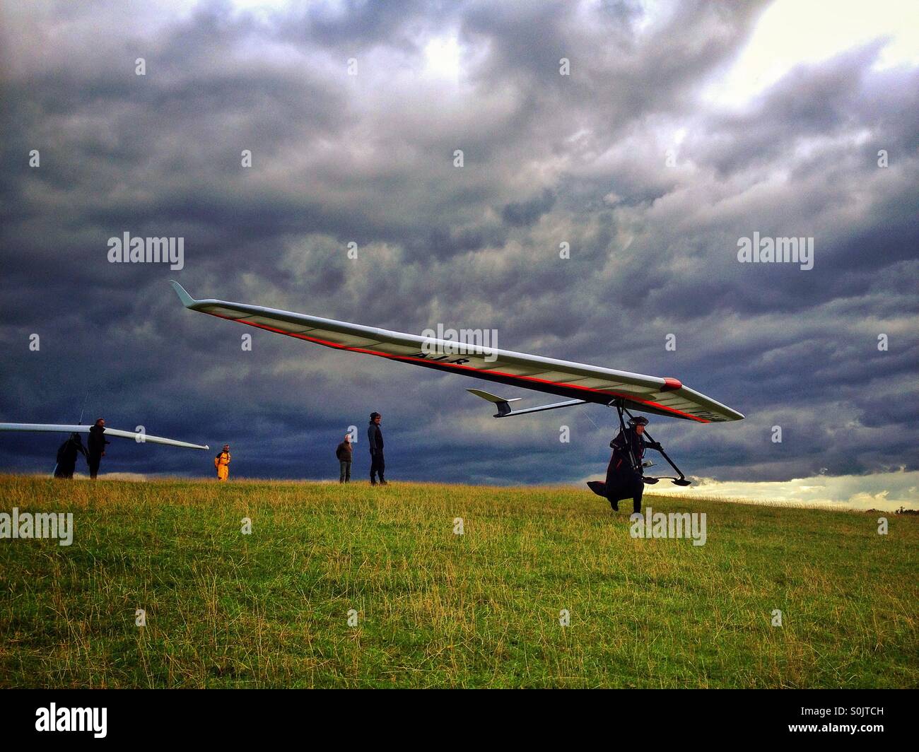Hang glider launching Stock Photo - Alamy