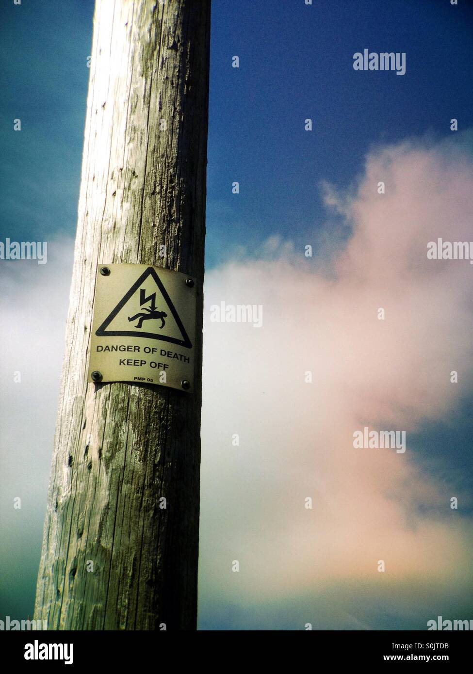 Telegraph pole with danger of death sign Stock Photo - Alamy