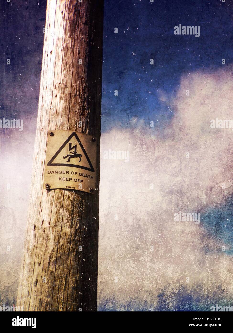 Telegraph pole with danger of death sign Stock Photo - Alamy