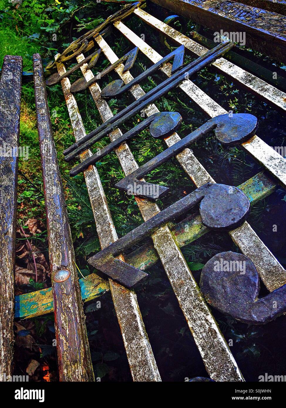 Musical notes attached to a bench Stock Photo - Alamy