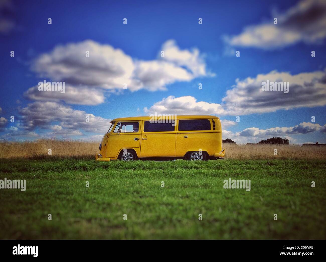 Yellow VW campervan Stock Photo - Alamy