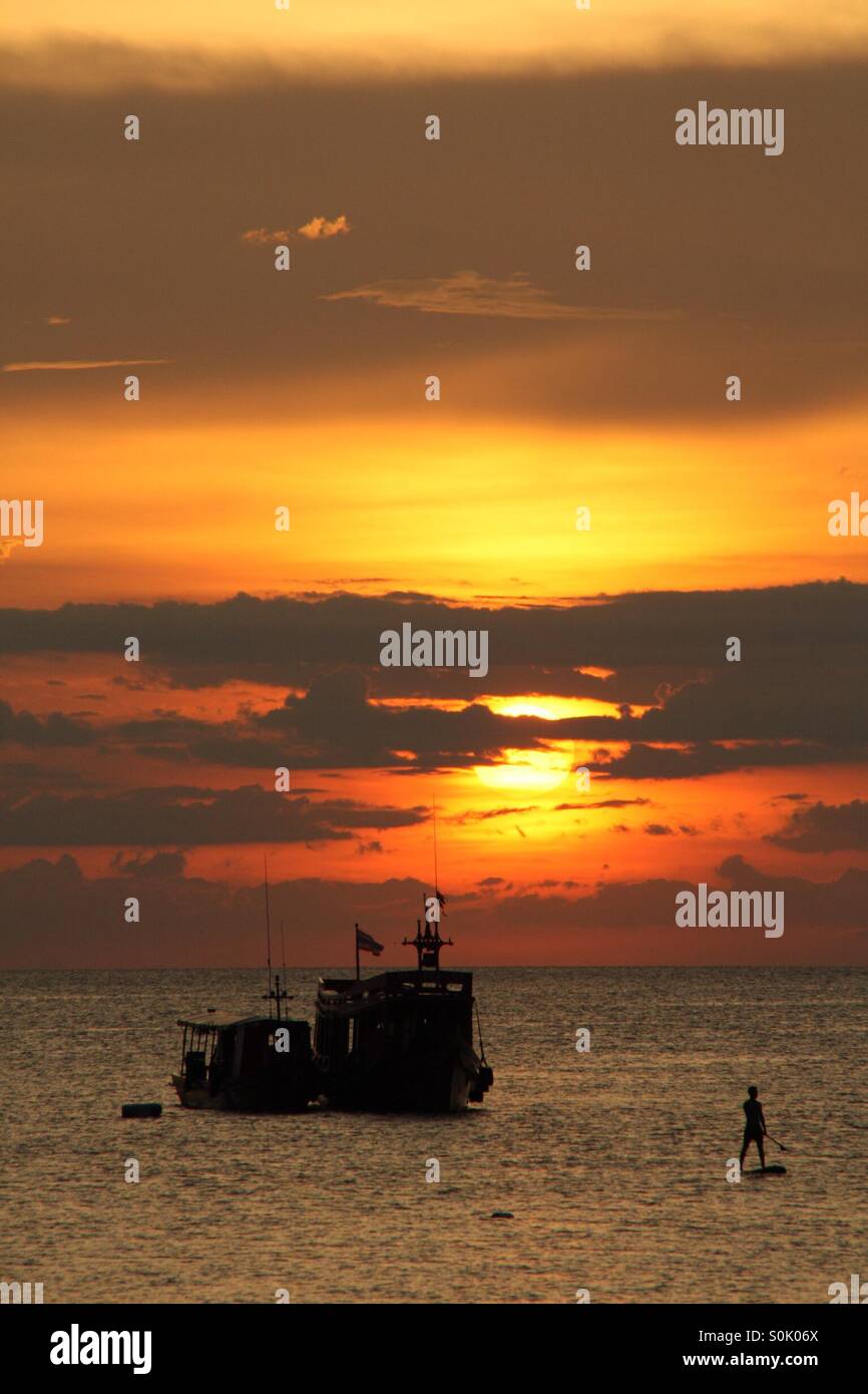 Sunset man boat hi-res stock photography and images - Alamy
