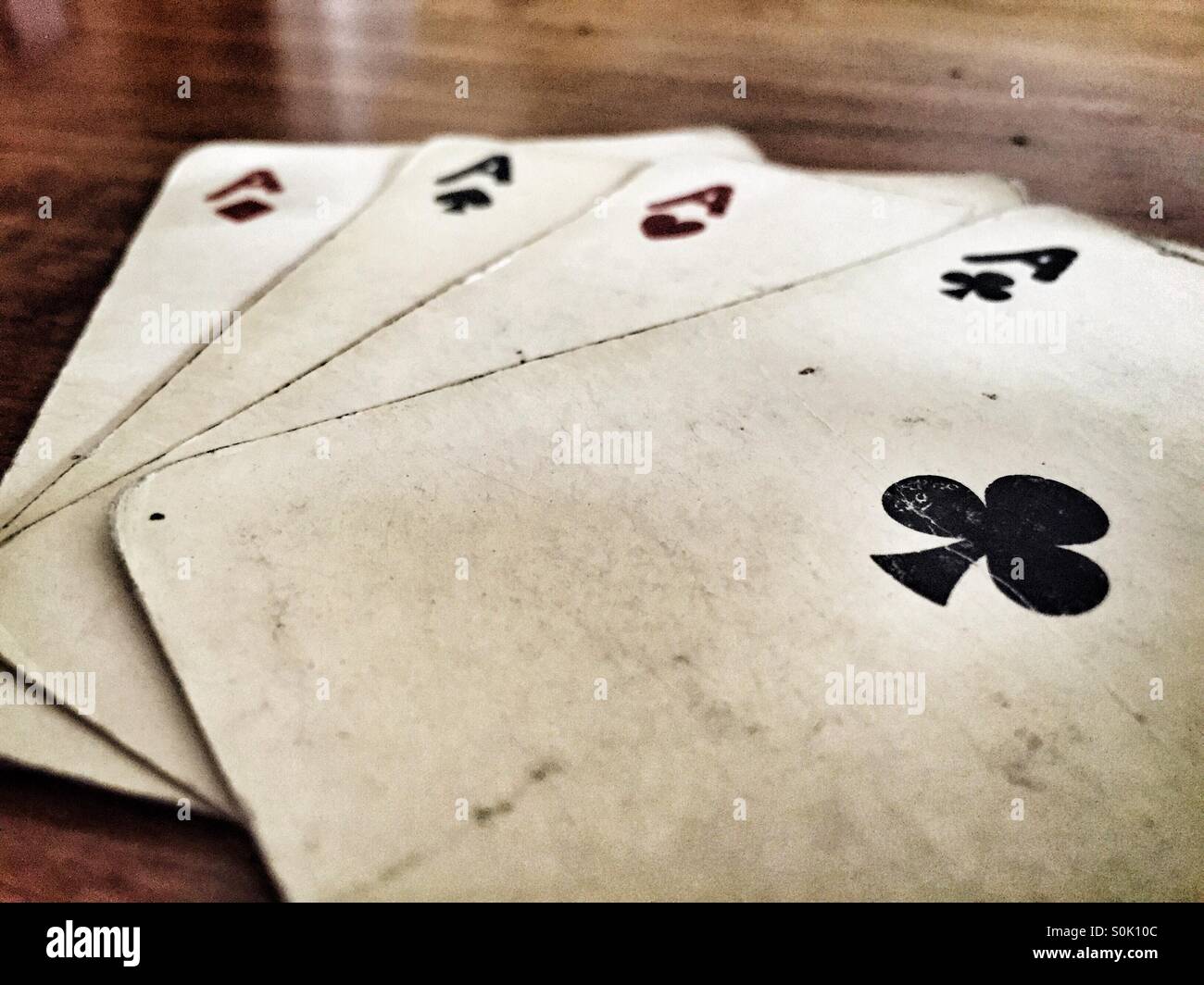Lucky card hand of four aces Stock Photo - Alamy
