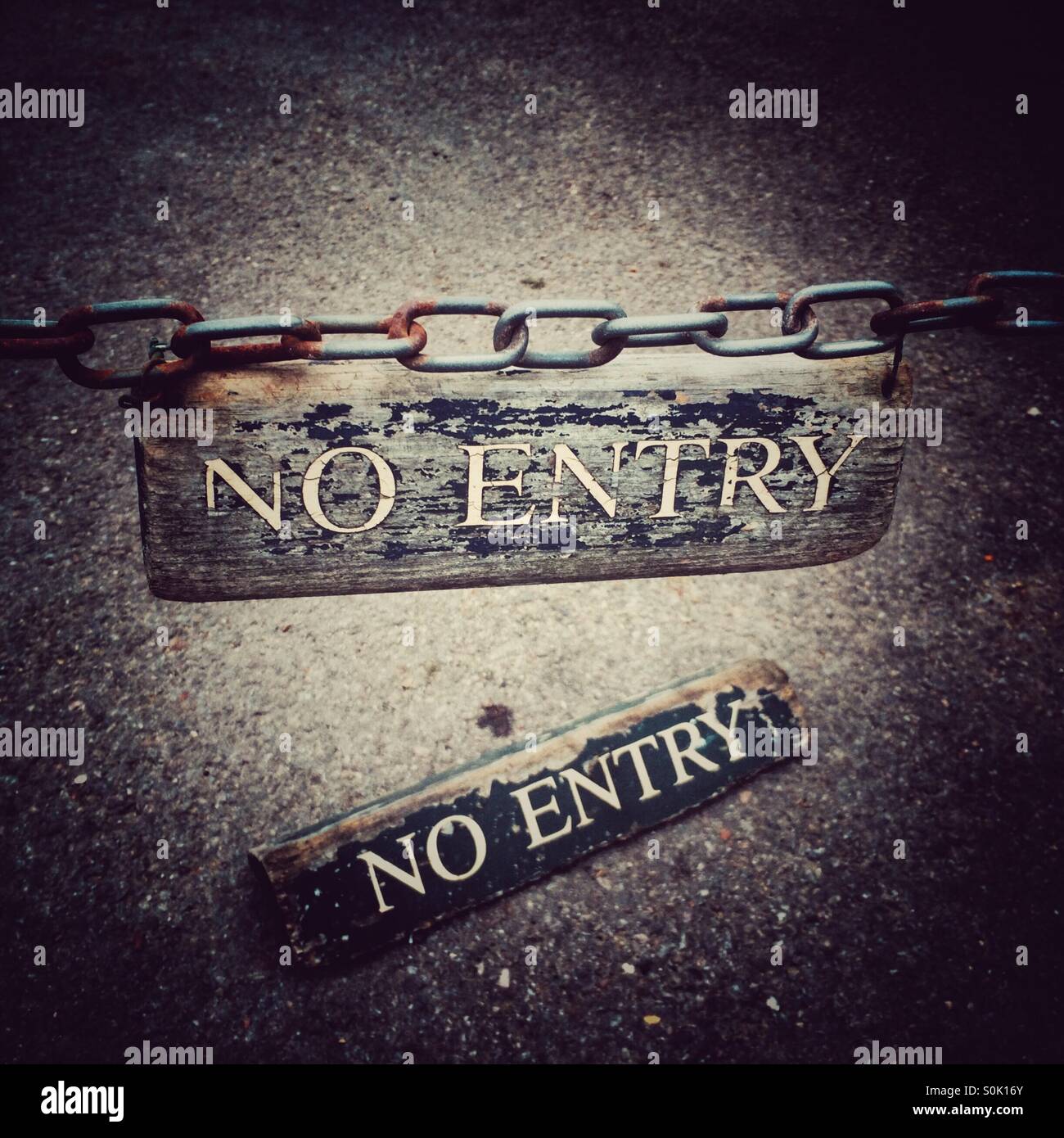 No entry sign hanging on chains Stock Photo - Alamy