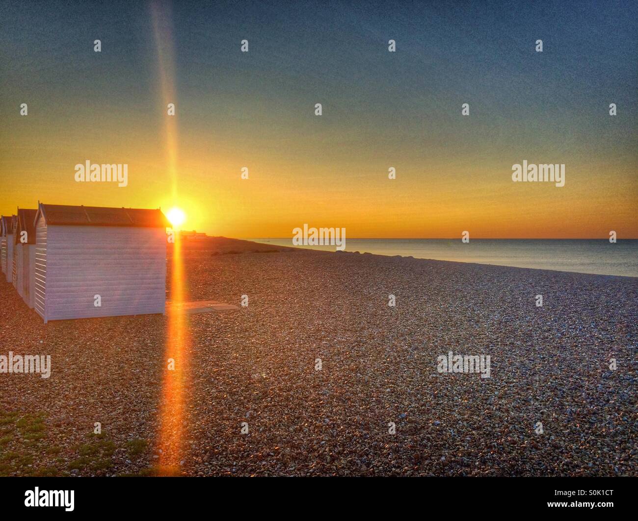 Rising sun beach hi-res stock photography and images - Alamy