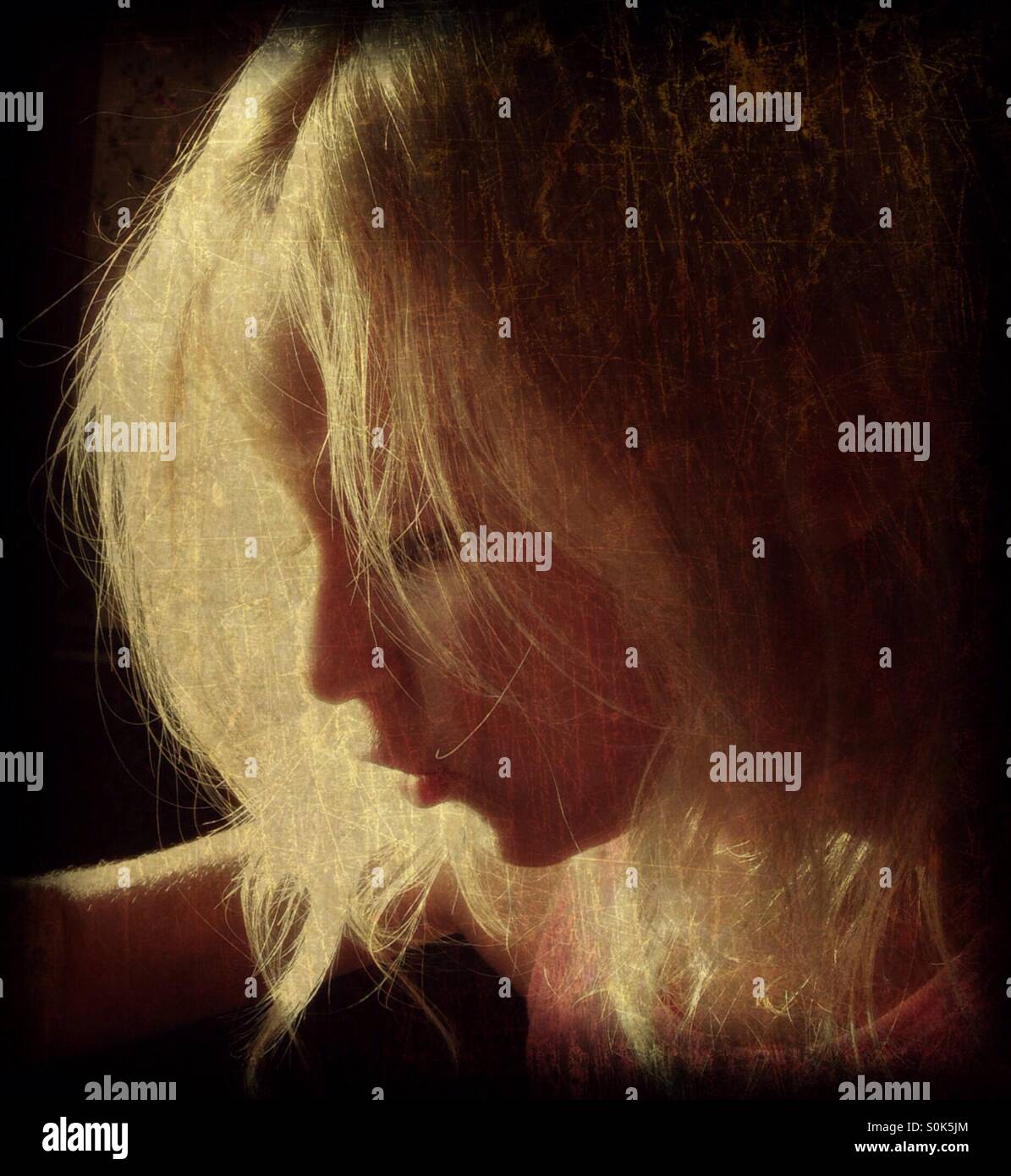 Sunlight illuminating a little girl's hair Stock Photo - Alamy