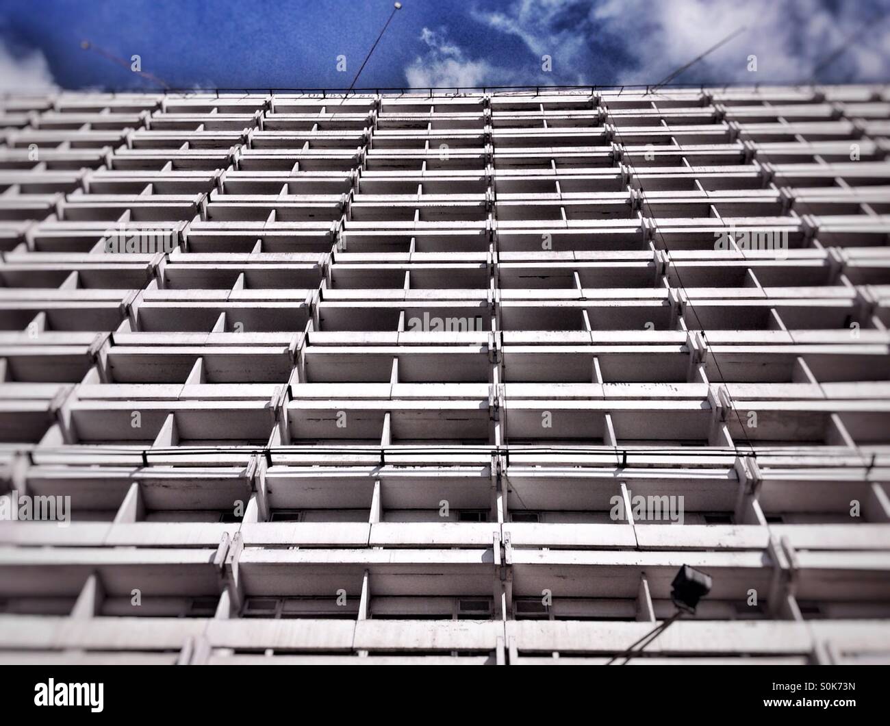 Outside Looking Up at the building wall with balconies Stock Photo - Alamy