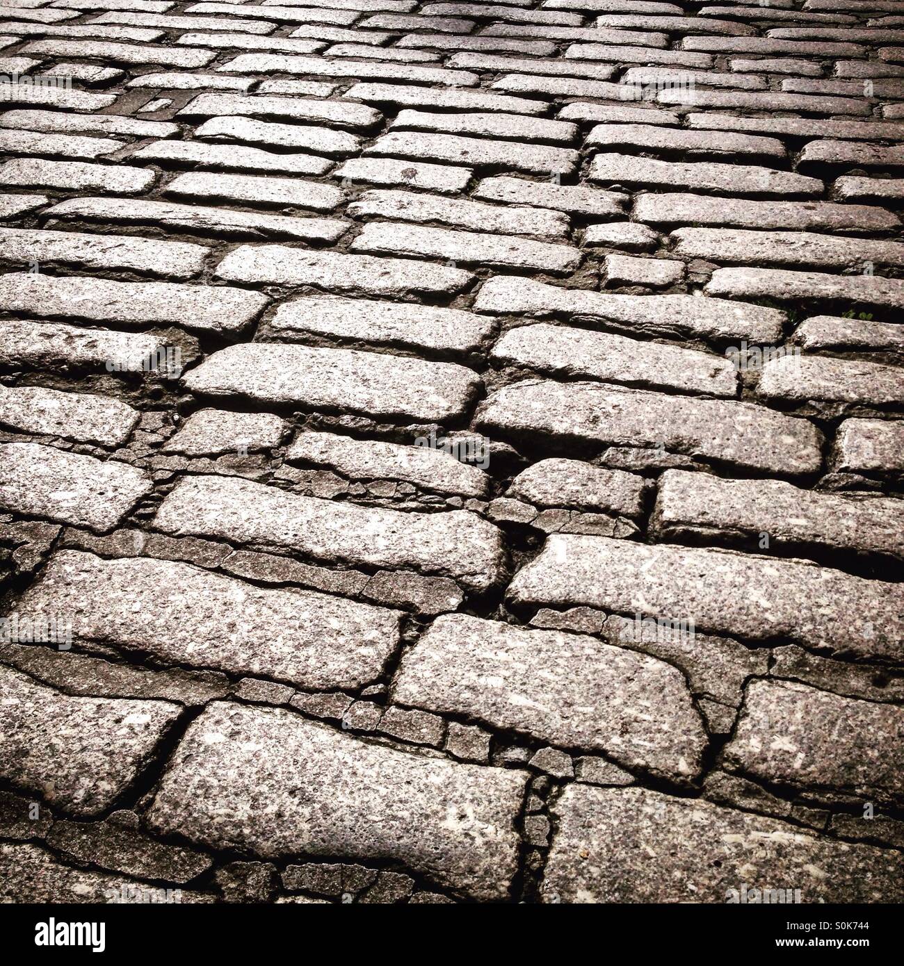 Old English cobblestone road close up Stock Photo - Alamy