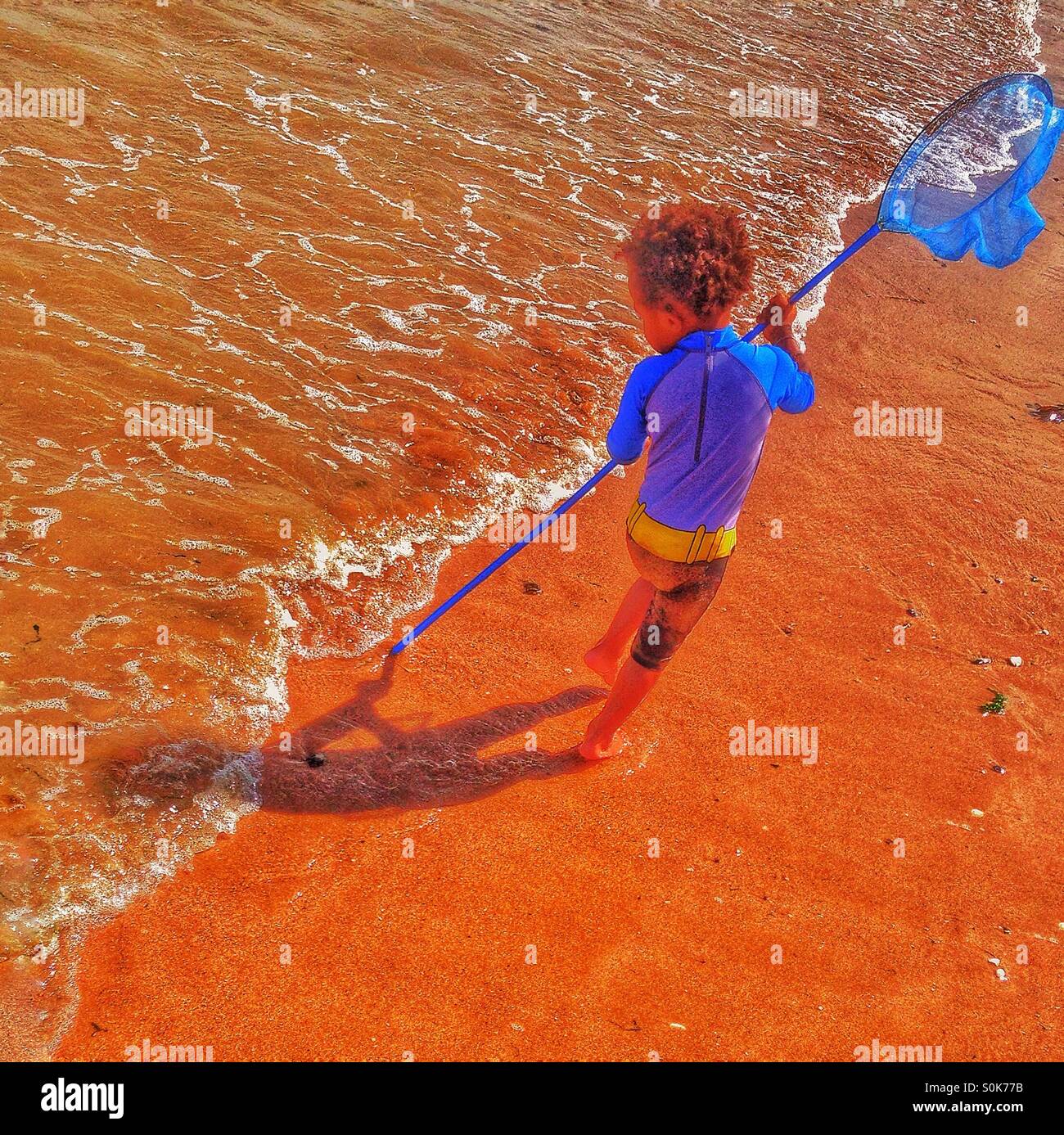 Child at the beach Stock Photo - Alamy