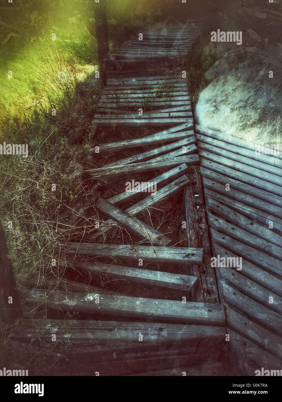 Damaged wooden path Stock Photo - Alamy