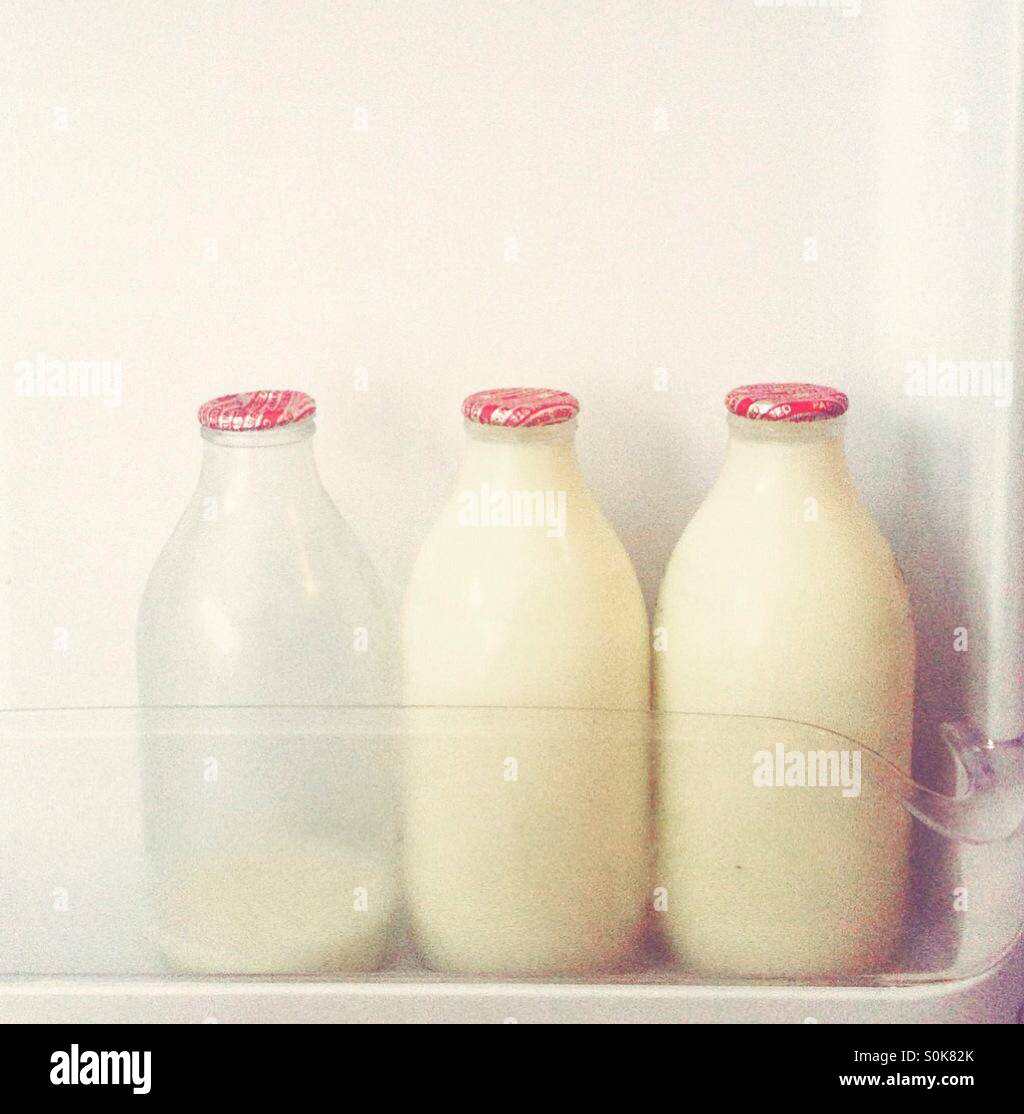 Glass milk bottles in a fridge door hi-res stock photography and images ...