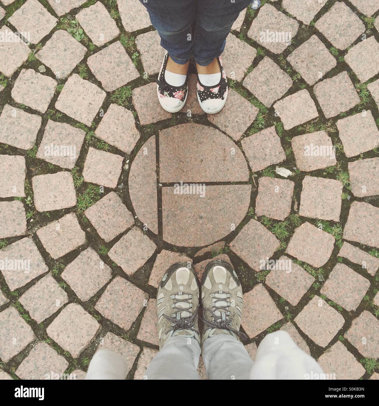 Circled floor and two pair of feet surrounding the center circle Stock ...