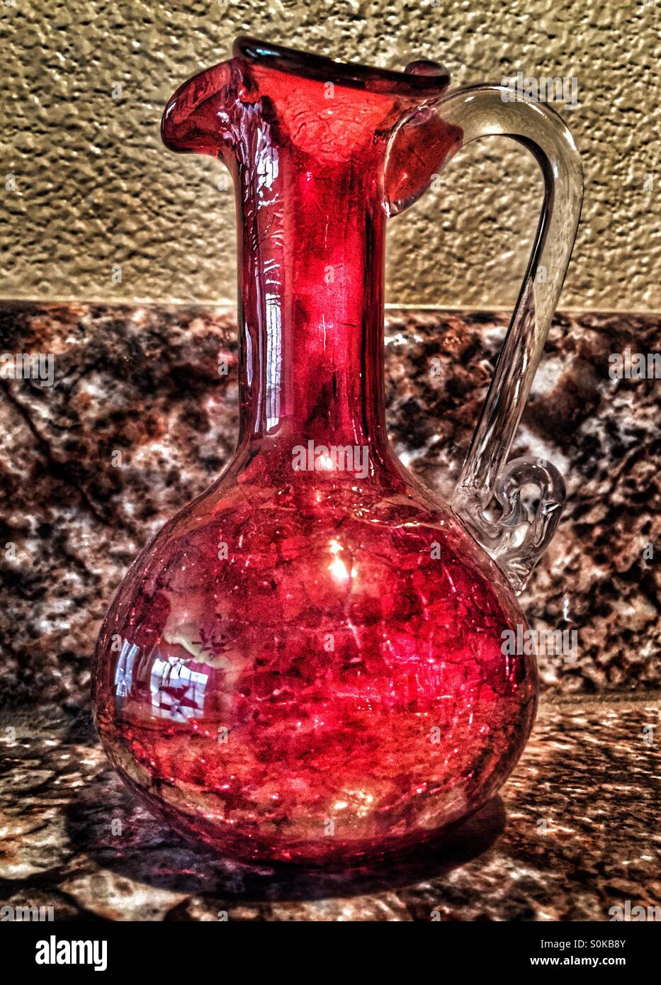 Red glass pitcher Stock Photo - Alamy