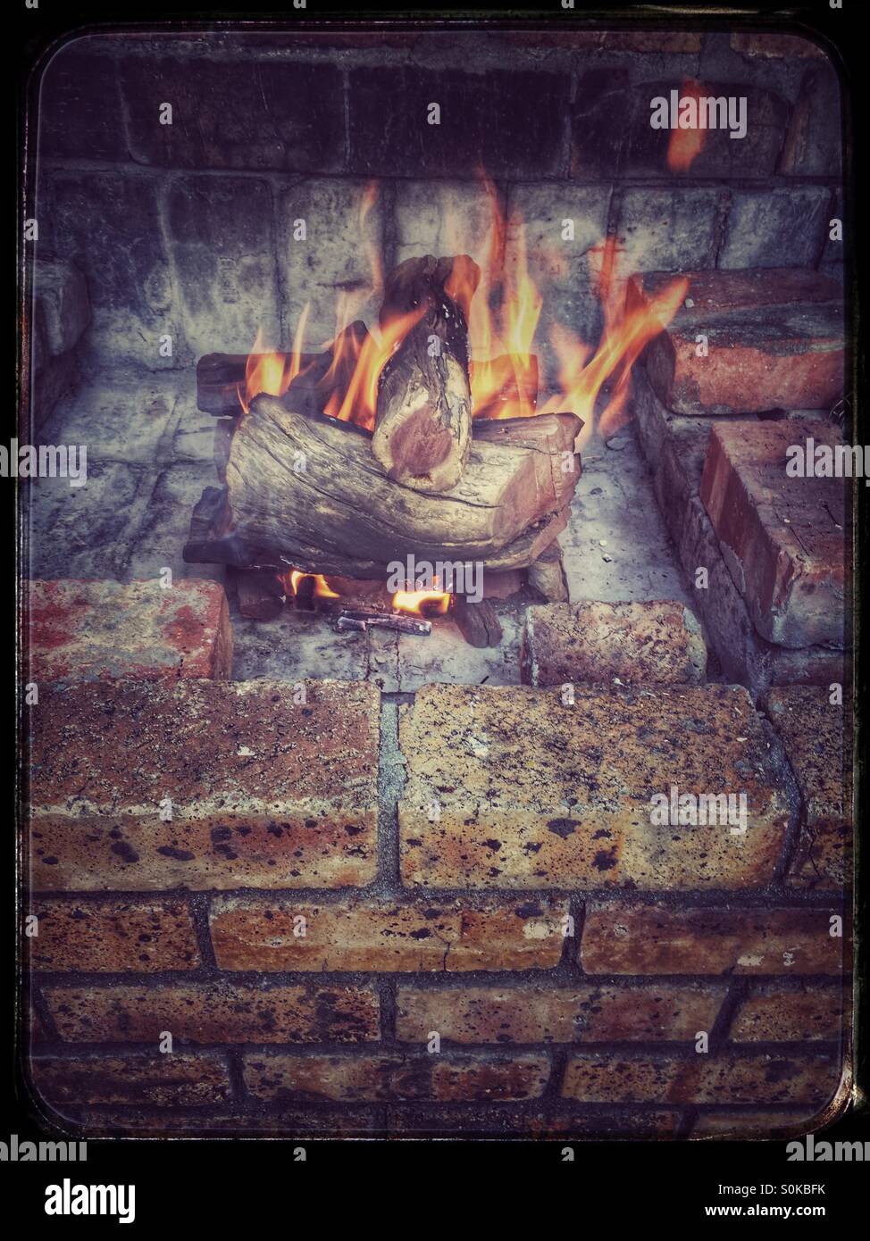 Fire burning in fireplace Stock Photo - Alamy