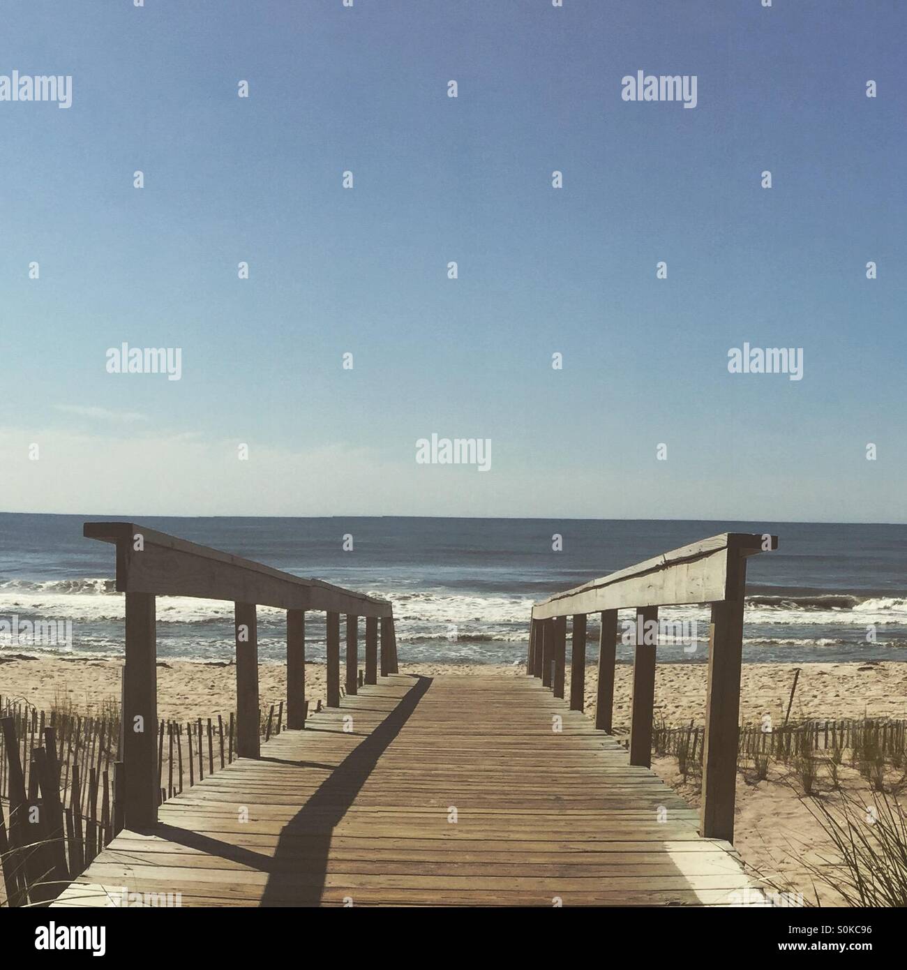 Feeling free at the Beach from the end of Boardwalk Stock Photo - Alamy