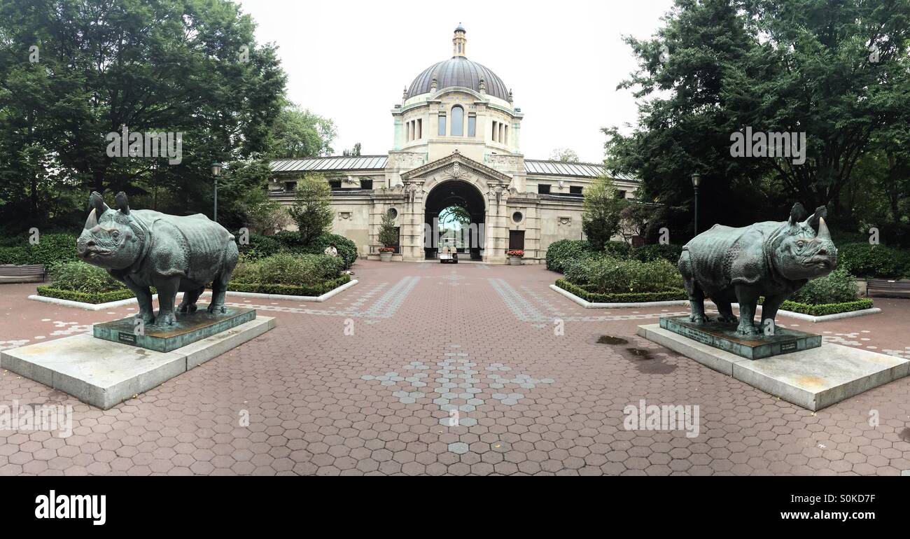 Bronx zoo center flanked by rhino sculptures Stock Photo - Alamy