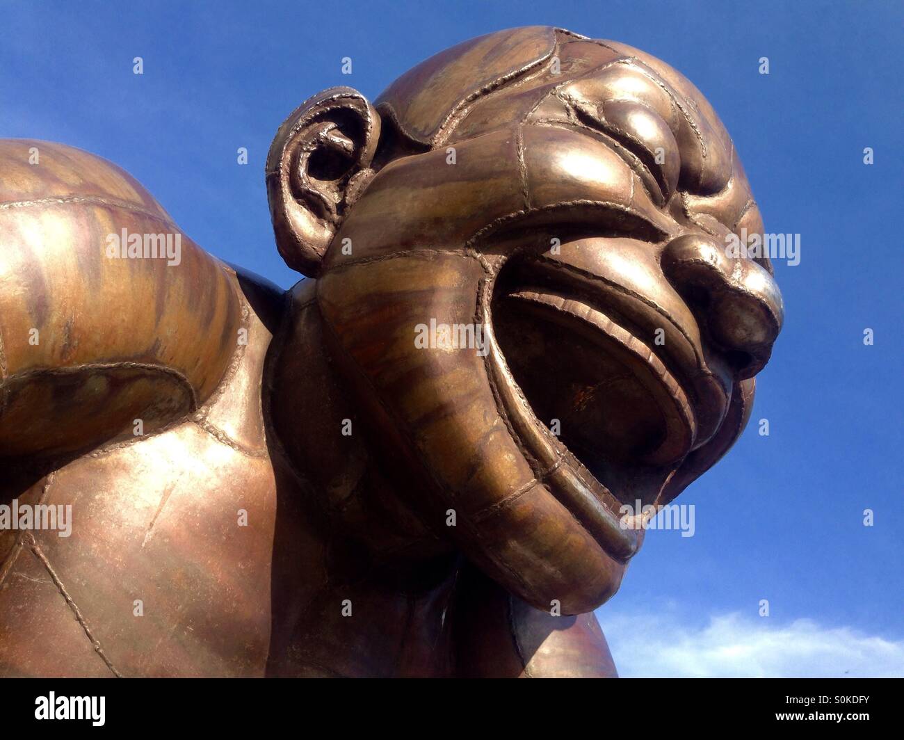 Laughing man statue Stock Photo - Alamy