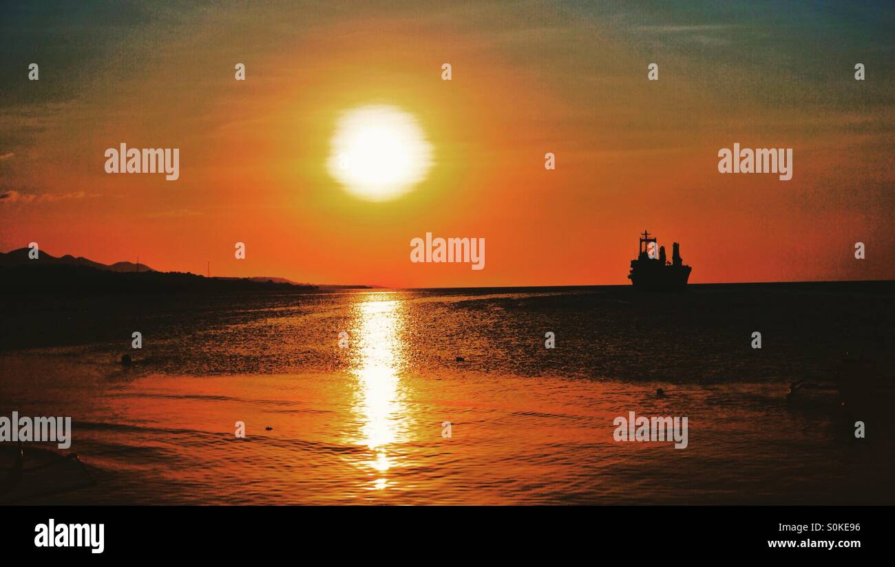 Sun & ship Stock Photo - Alamy