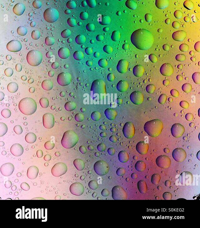 Water droplets on a rainbow effect background. Polarisation technique ...