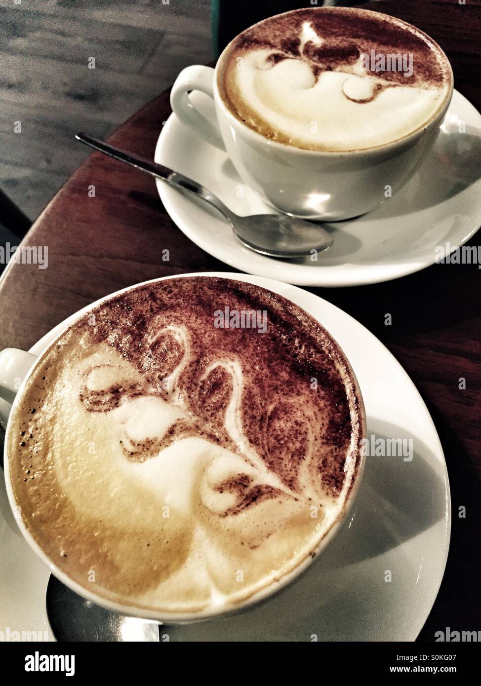 Two coffee lattes Stock Photo - Alamy