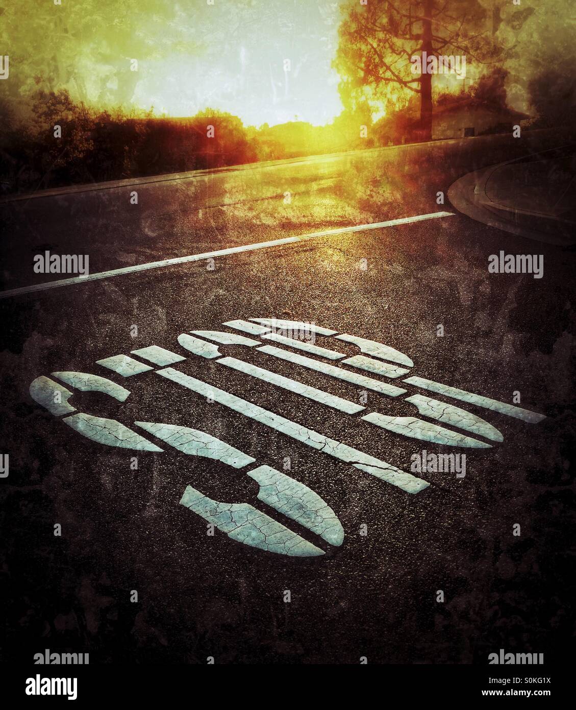 A Painted Stop Sign On The Street At Sunset Stock Photo - Alamy