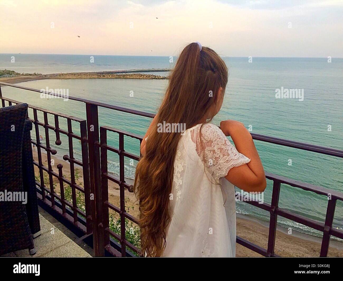 Little girl looking at the sea Stock Photo - Alamy