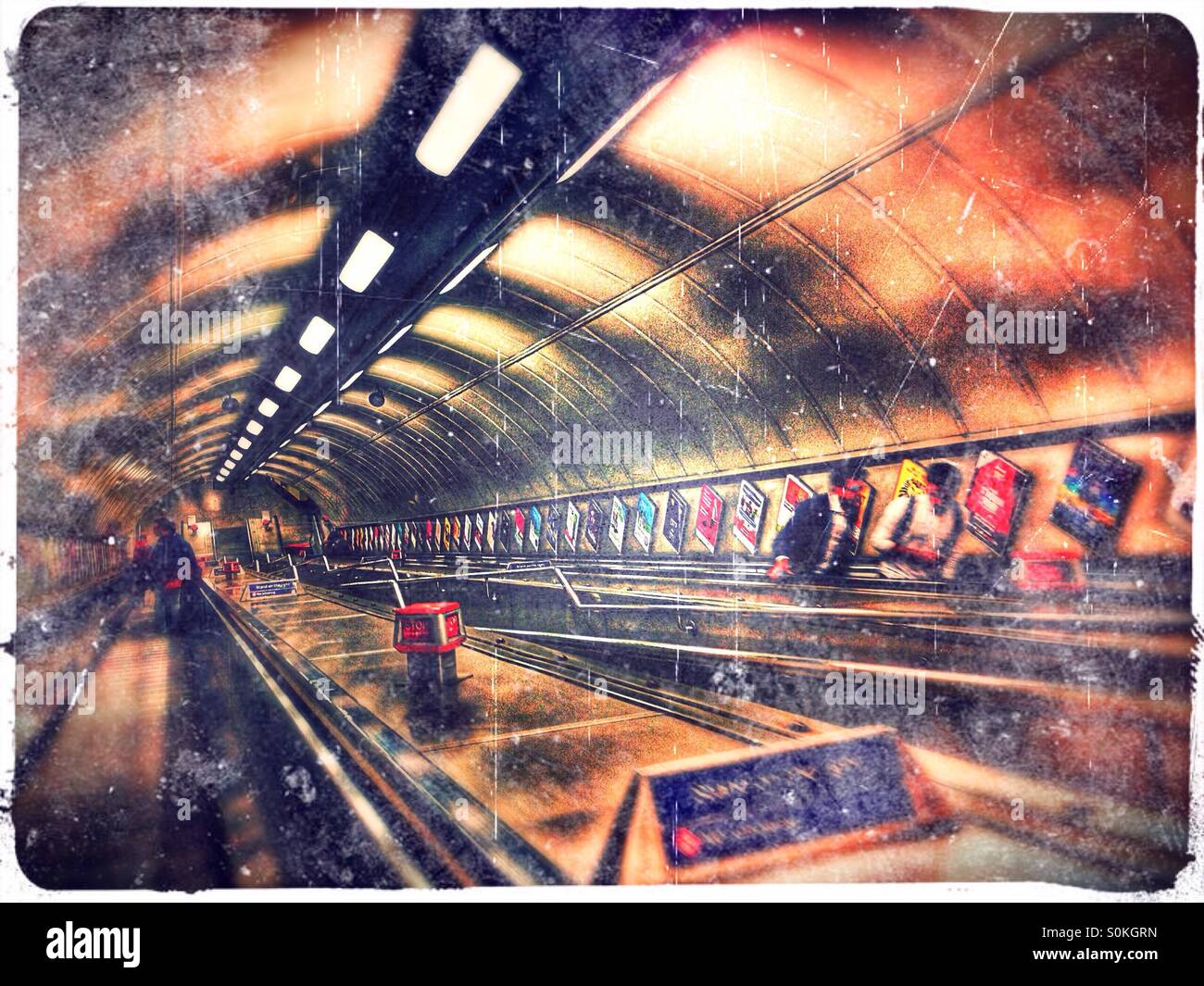 Interior of underground station showing escalators, London, England ...