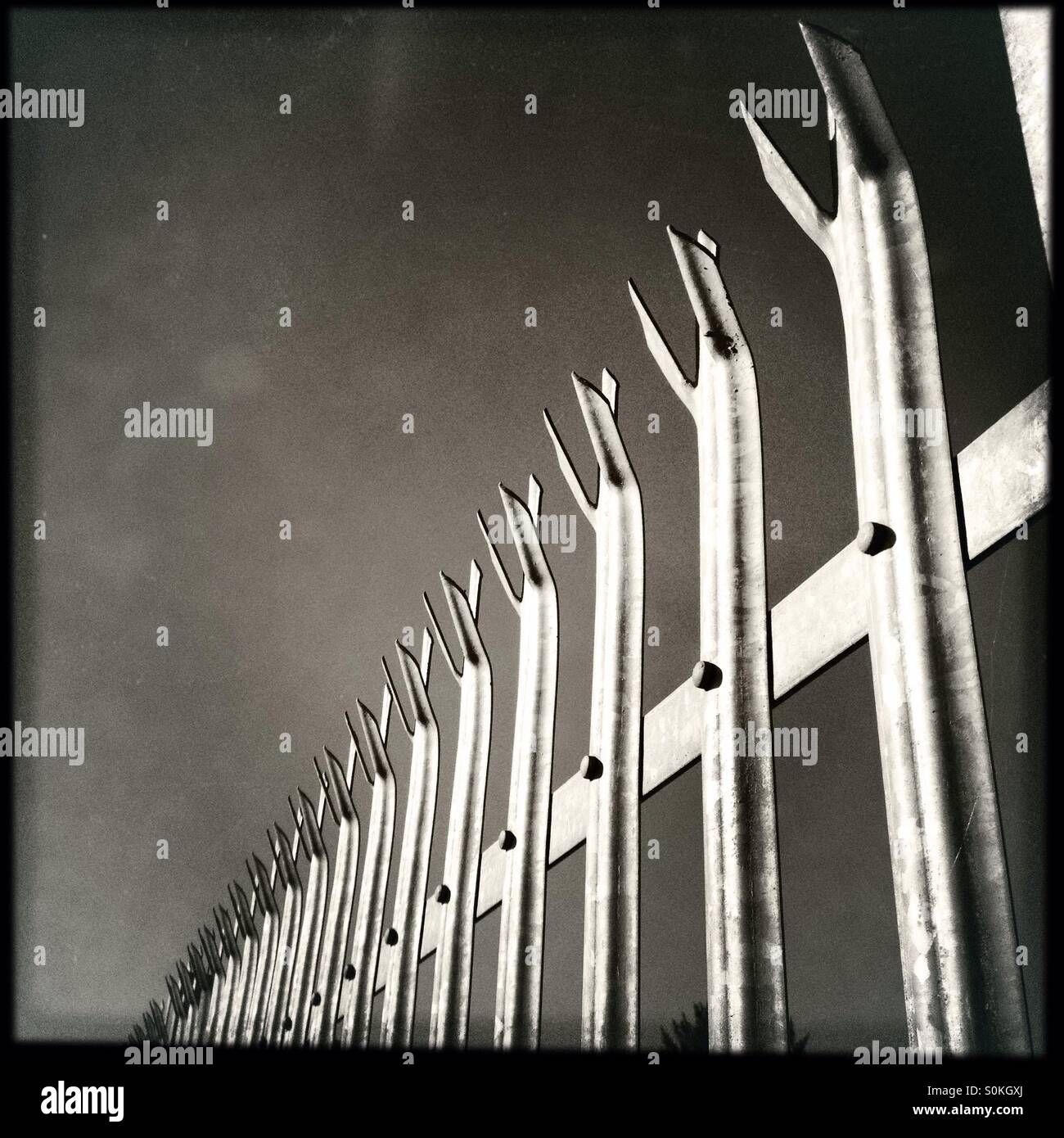 Fence with sharp points Stock Photo - Alamy