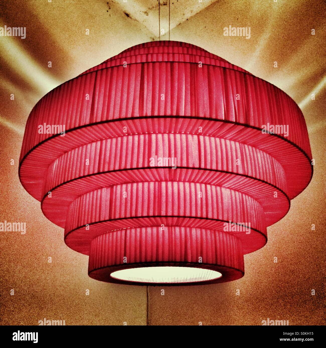 A bright red designer lampshade Stock Photo - Alamy