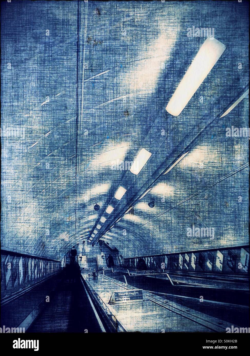 Interior of underground station showing escalators, London, England ...