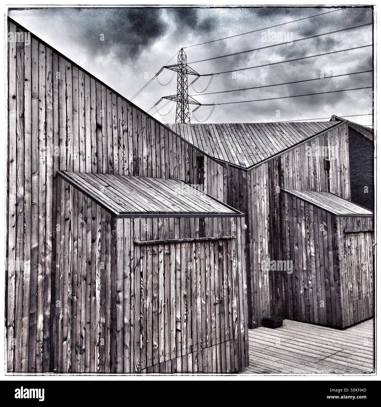 Wooden building with power line Stock Photo - Alamy