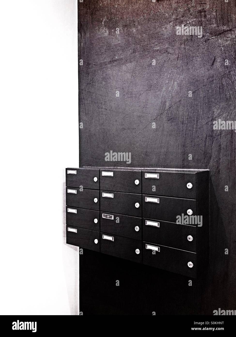 Apartment letterboxes on black and white background Stock Photo - Alamy