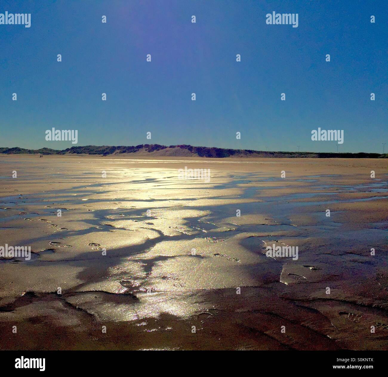 Beach after the tide Stock Photo - Alamy