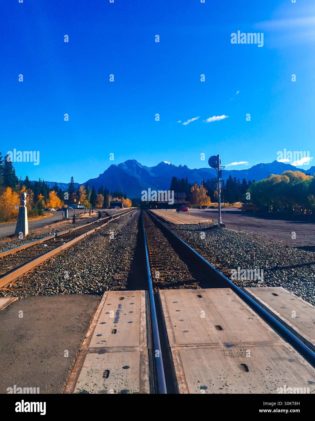 Banff train station with the Rocky Mountains in the background. Late ...