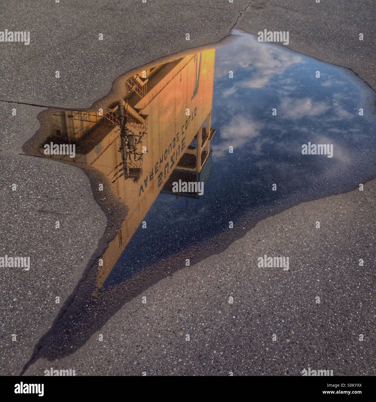 An old warehouse in Tokyo, reflected in a puddle Stock Photo - Alamy