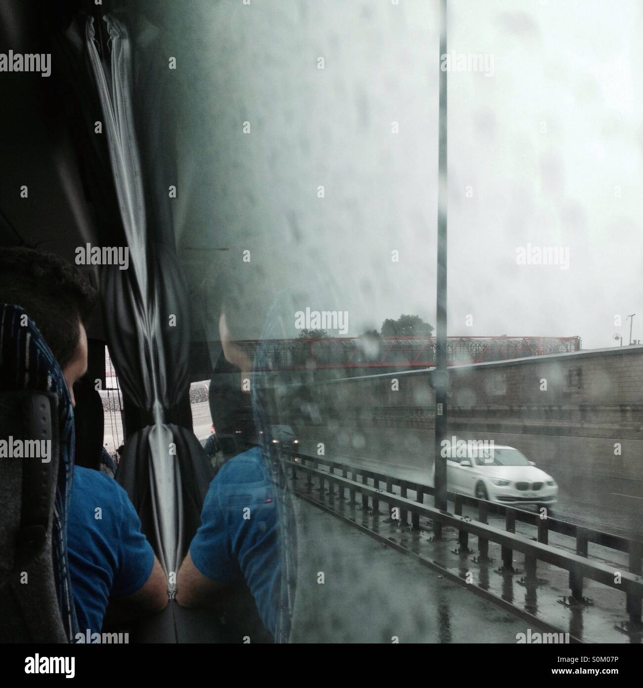 Man looking outside the window Stock Photo - Alamy