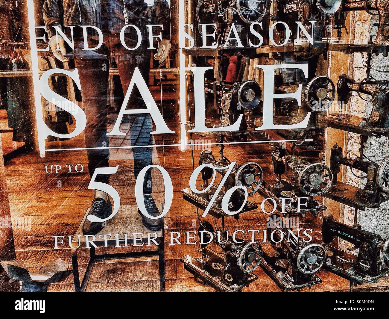Sale sign in a clothes shop window Stock Photo - Alamy