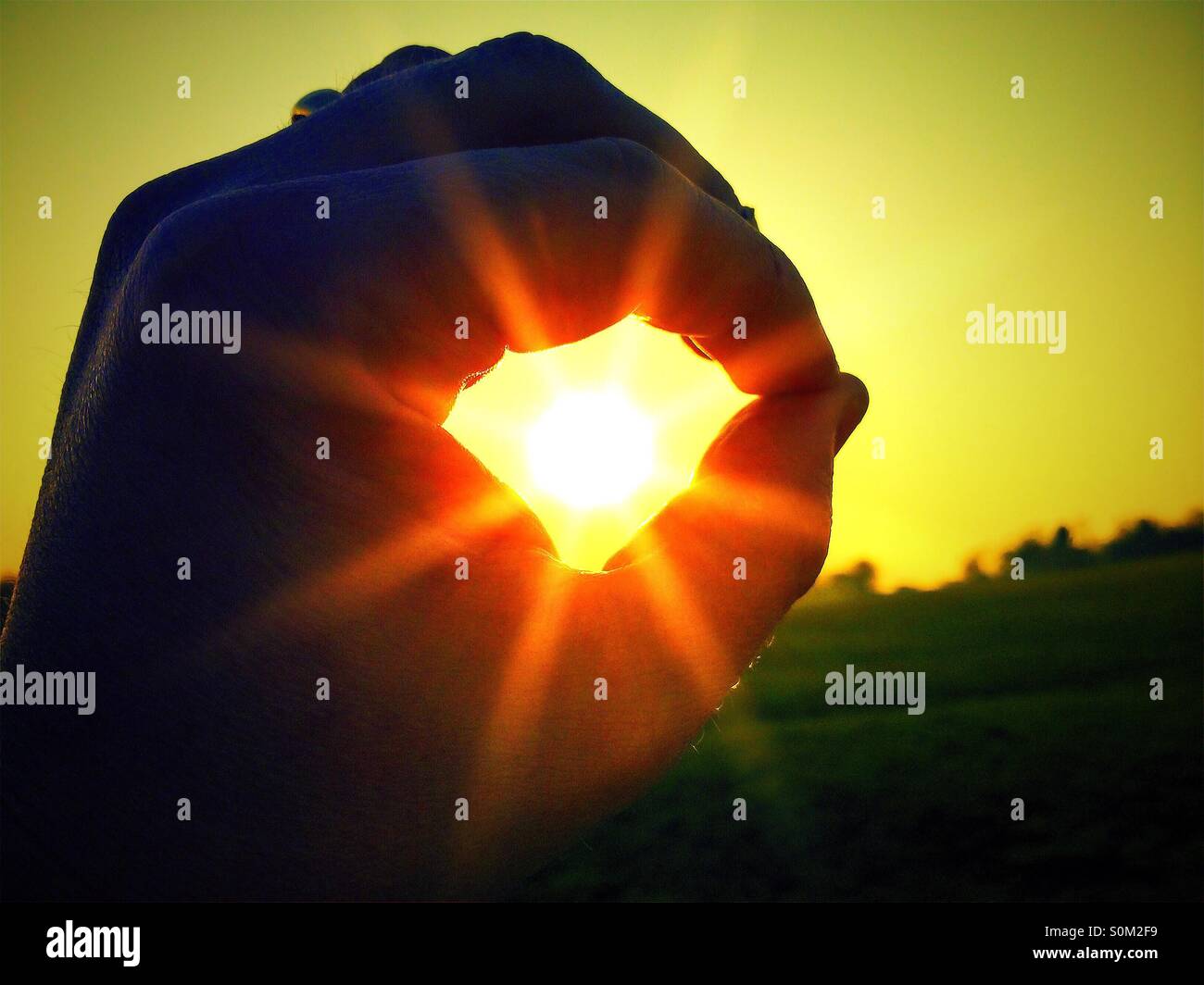 Sun in the hand hi-res stock photography and images - Alamy