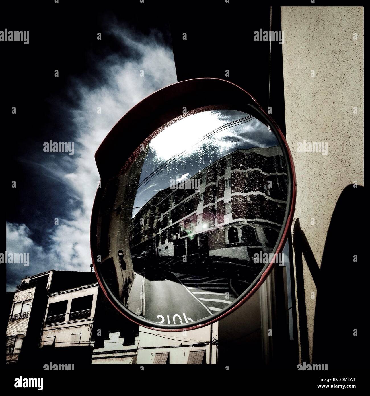 Reflection of a street scene in a blindspot mirror, Mora d'Ebre, Spain ...
