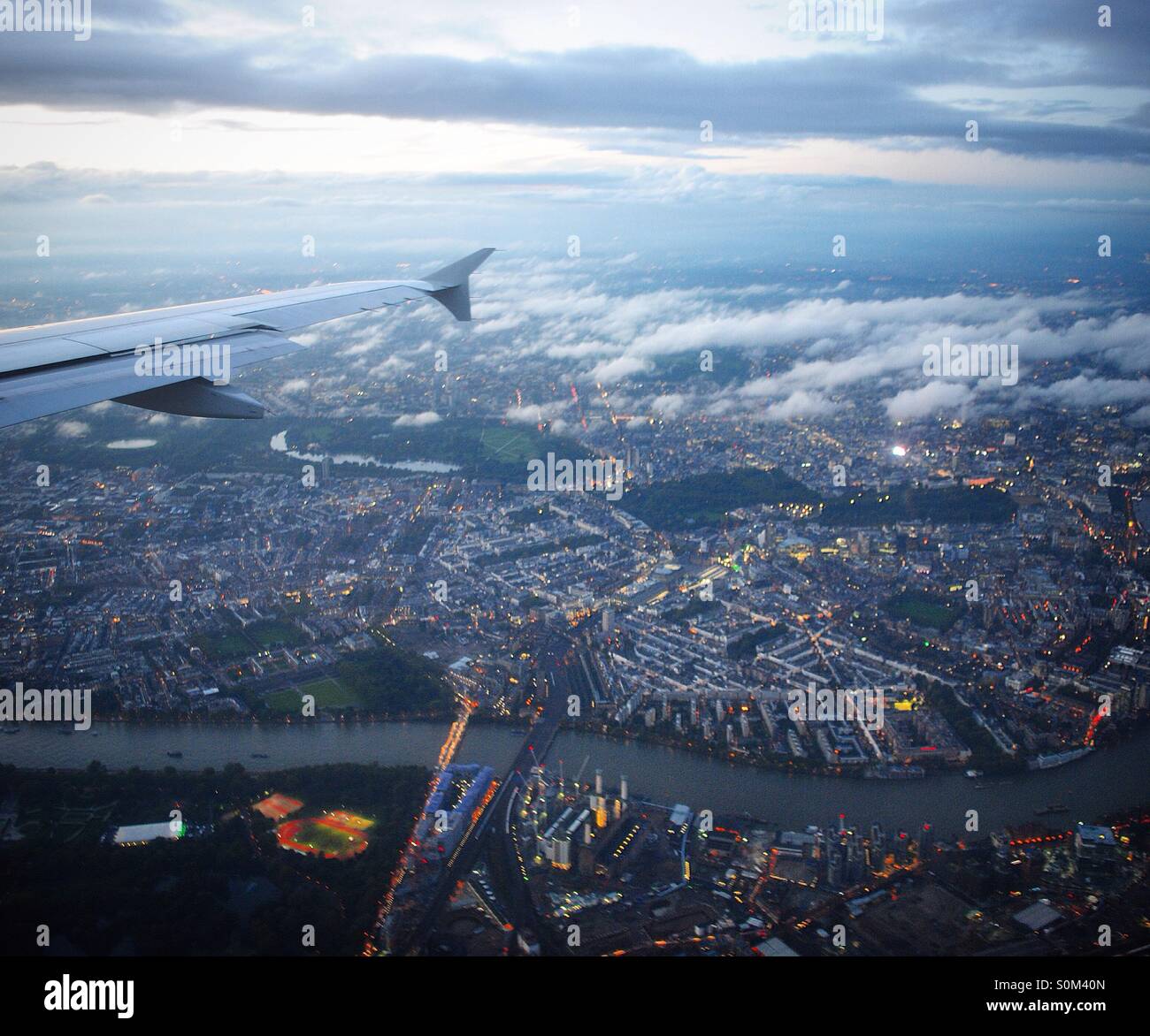 Flying over London on dusk Stock Photo - Alamy