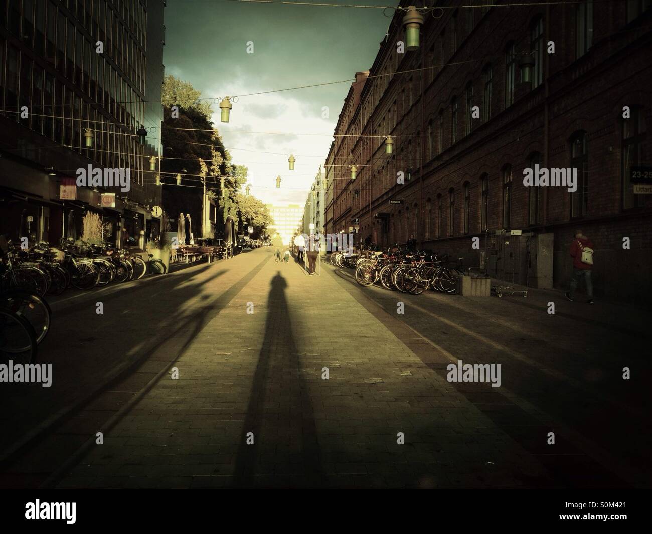 Dramatic shadow on street hi-res stock photography and images - Alamy