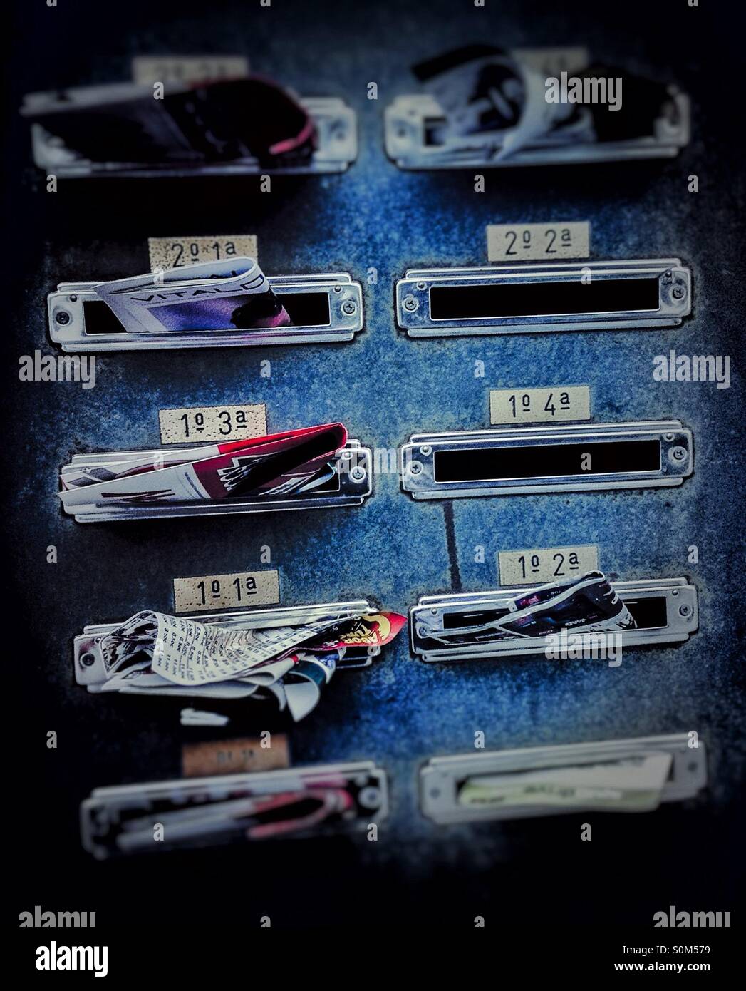 Junk spam mail letterboxes Stock Photo - Alamy