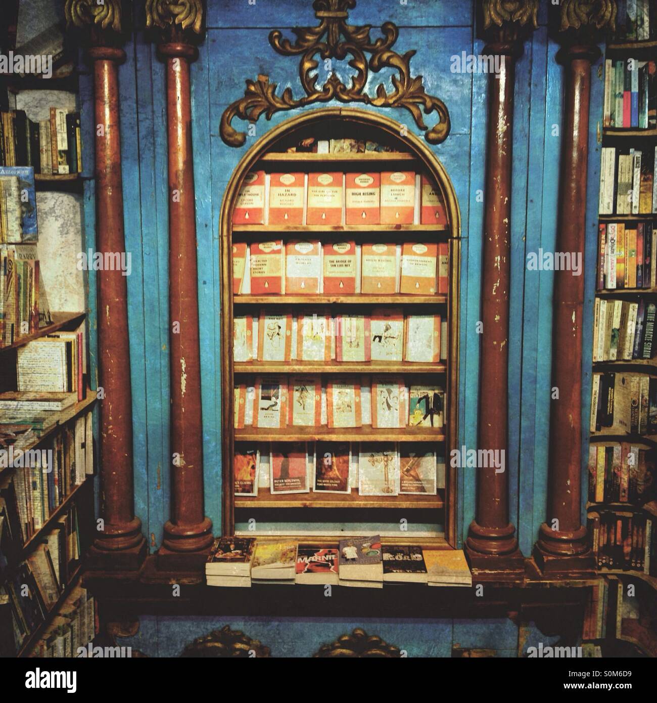 Interior of a bookshop, with the shelving in the form of an old temple ...