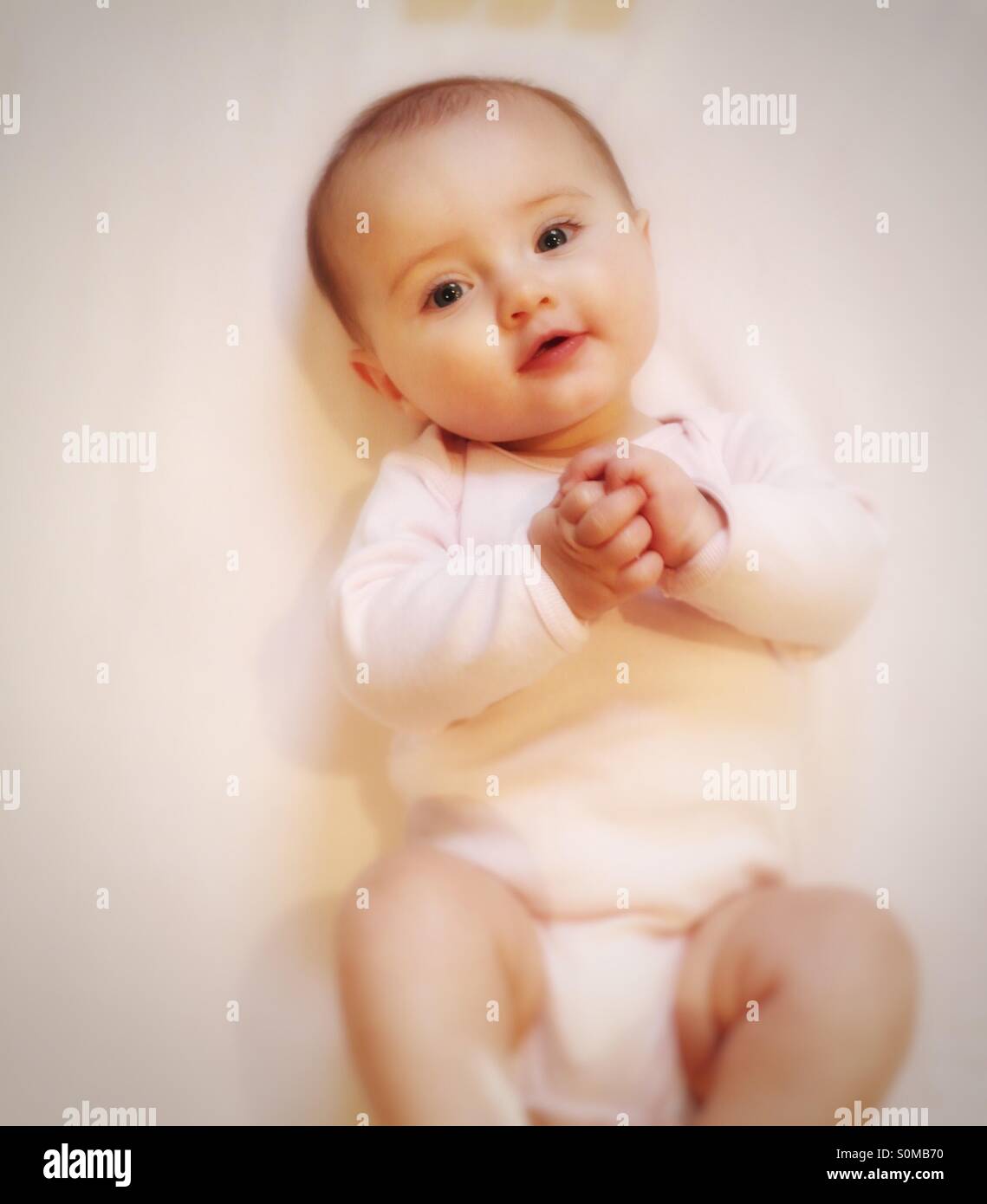Baby on back hi-res stock photography and images - Alamy